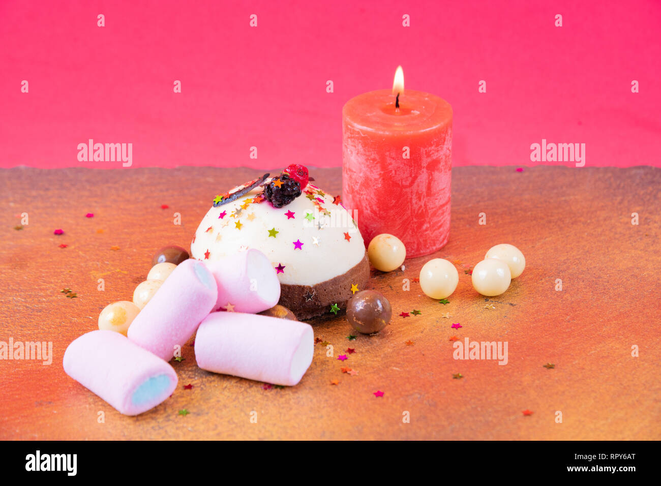 light and sumptuous pastry on a decorated support and with a colored ...