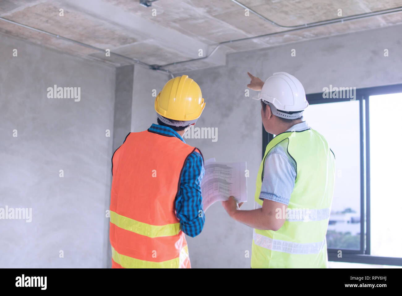 engineer inspector checking and introduce construction in building ...