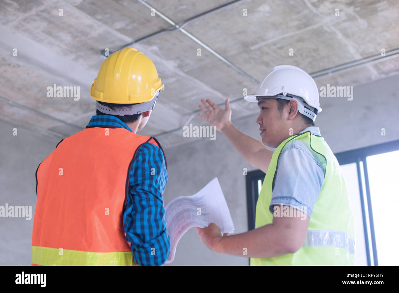 engineer inspector checking and introduce construction in building ...
