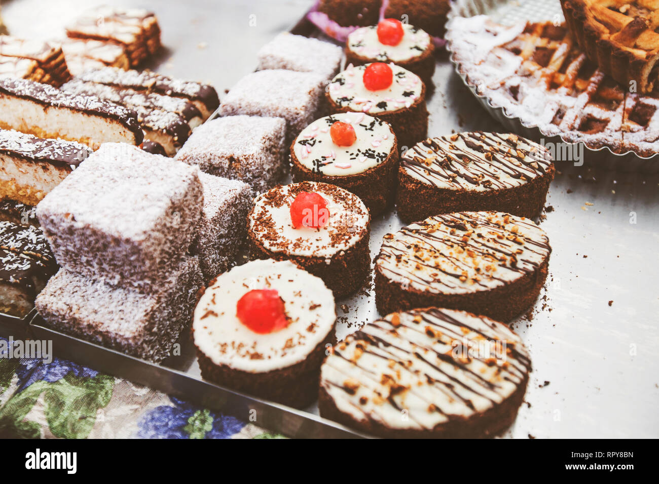 Different types of fresh handmade cakes for sale at sweet food market ...