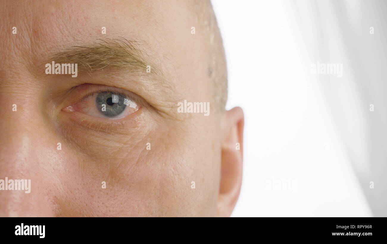Man with opened eyes blinking close up. Vision, eyesight, ophthalmology ...