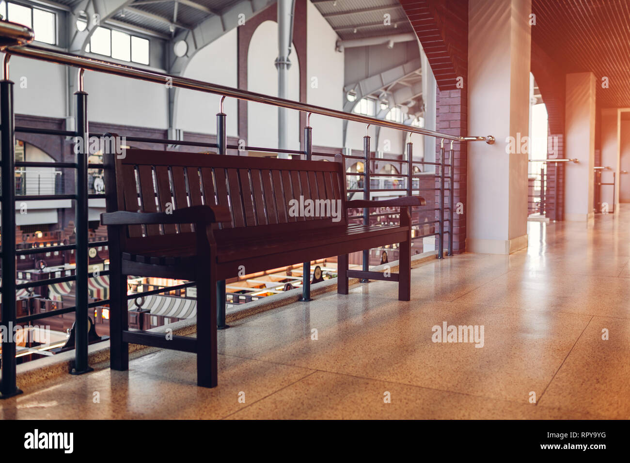 Interior of shopping center. Relax zone. Modern buildings. Benches to ...