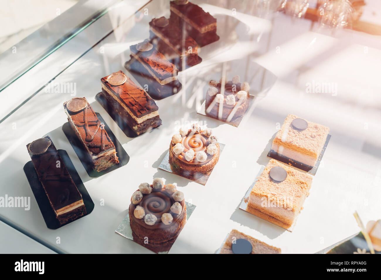 Assortment of colorful macaroons on cafe showcase. Variety of macaron ...