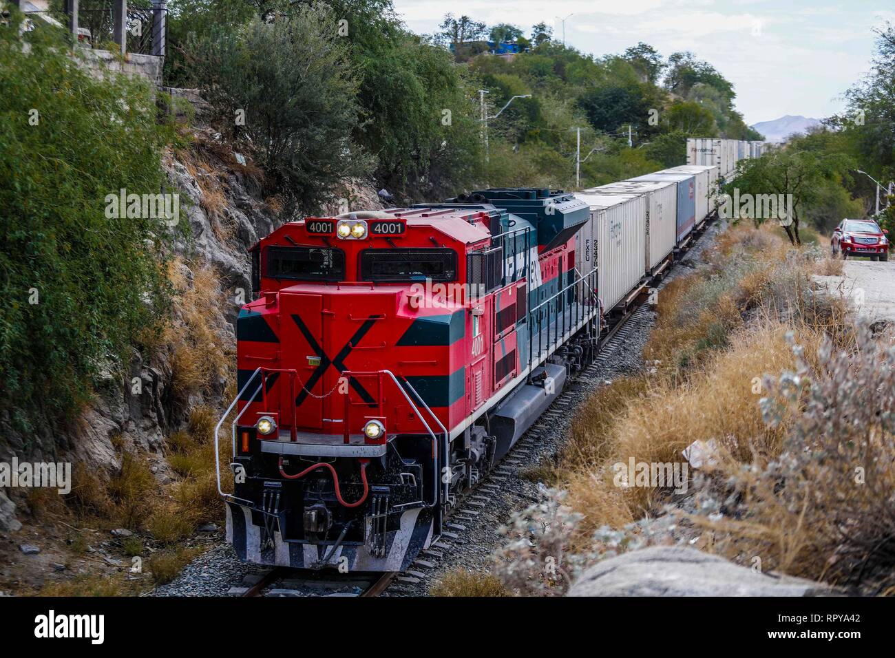 Train or Mexican railways passing through the popular colony in ...