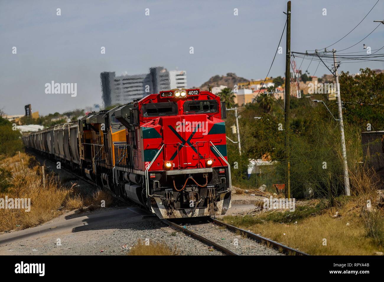 Train or Mexican railways passing through the popular colony in ...