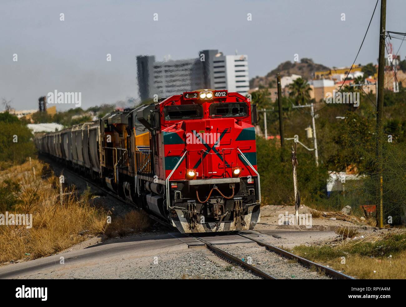 Train or Mexican railways passing through the popular colony in ...