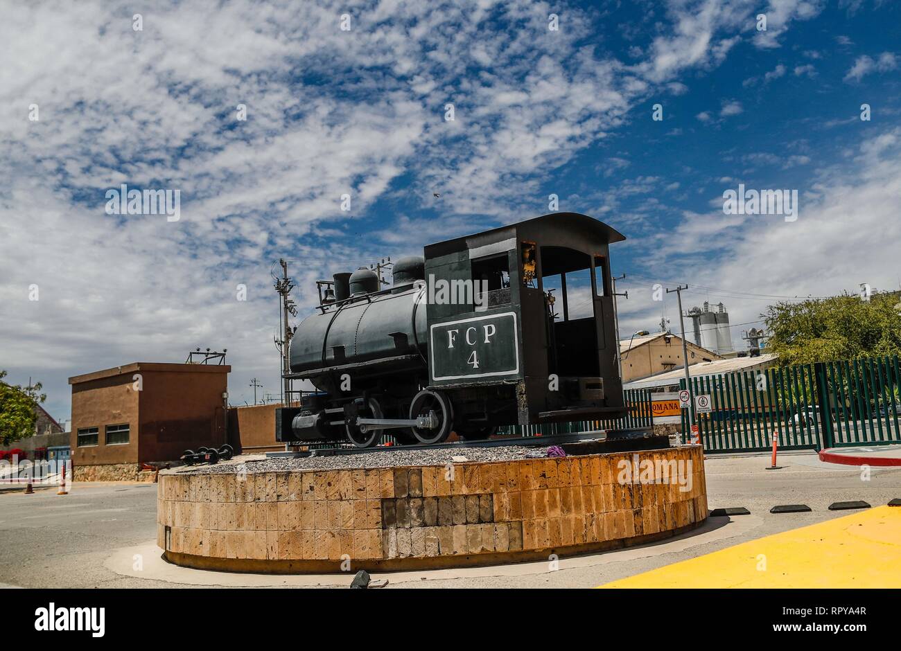 Train or Mexican railways passing through the popular colony in ...