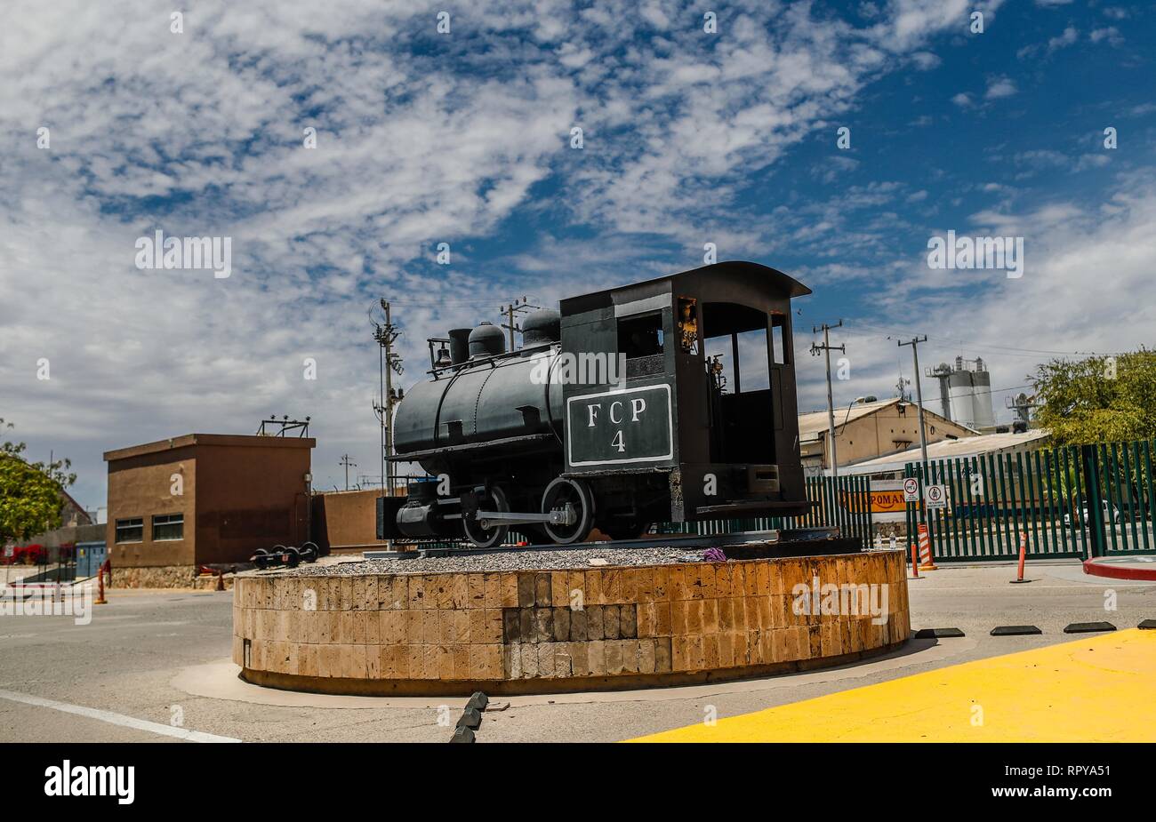 Train or Mexican railways passing through the popular colony in ...