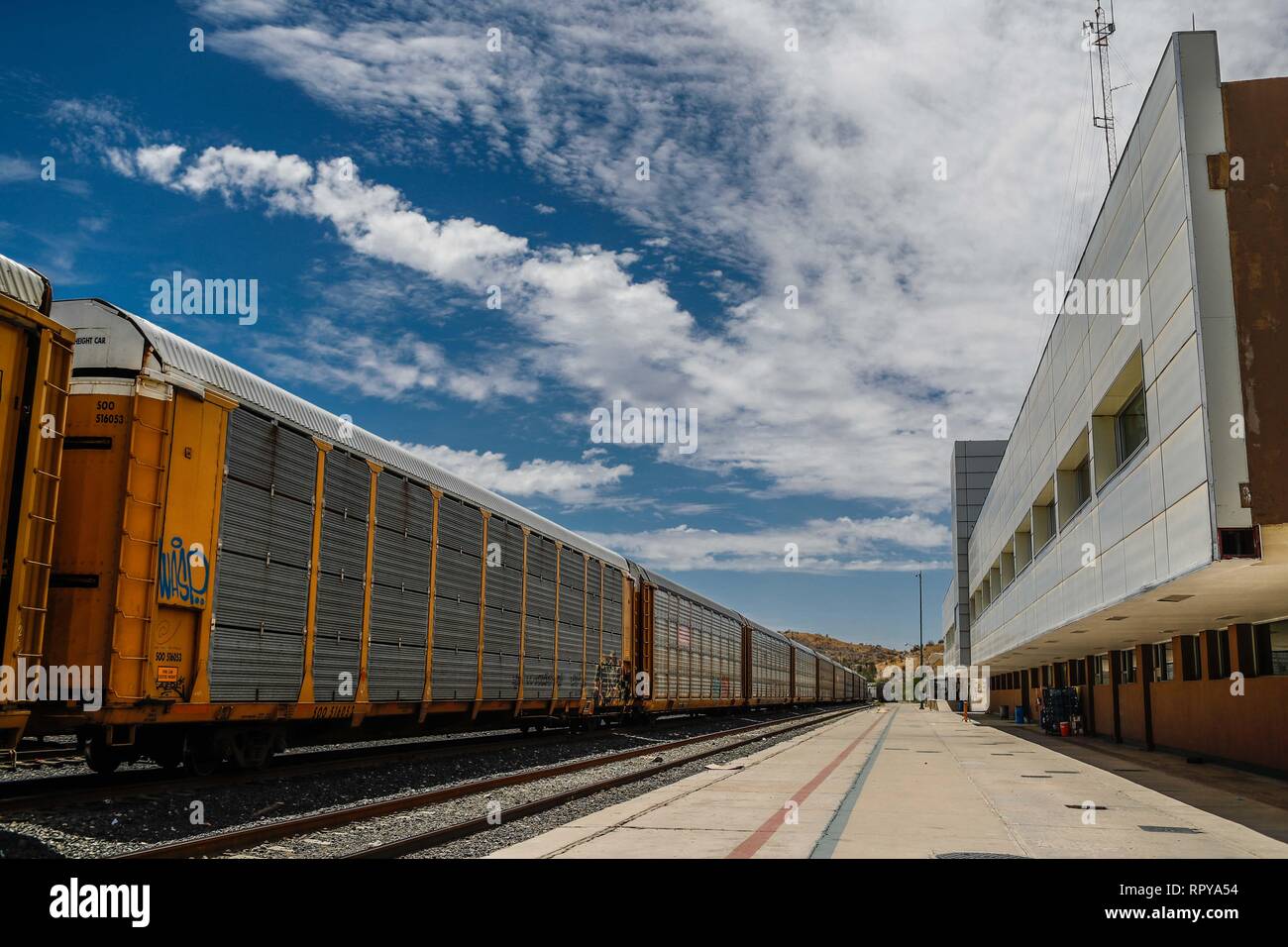 Train or Mexican railways passing through the popular colony in ...