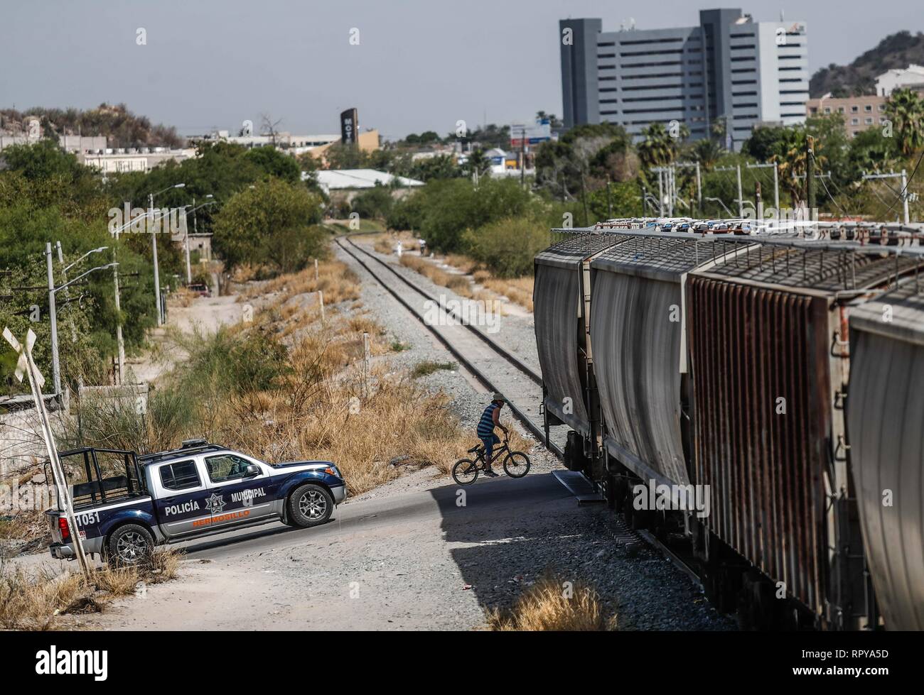 Train or Mexican railways passing through the popular colony in ...