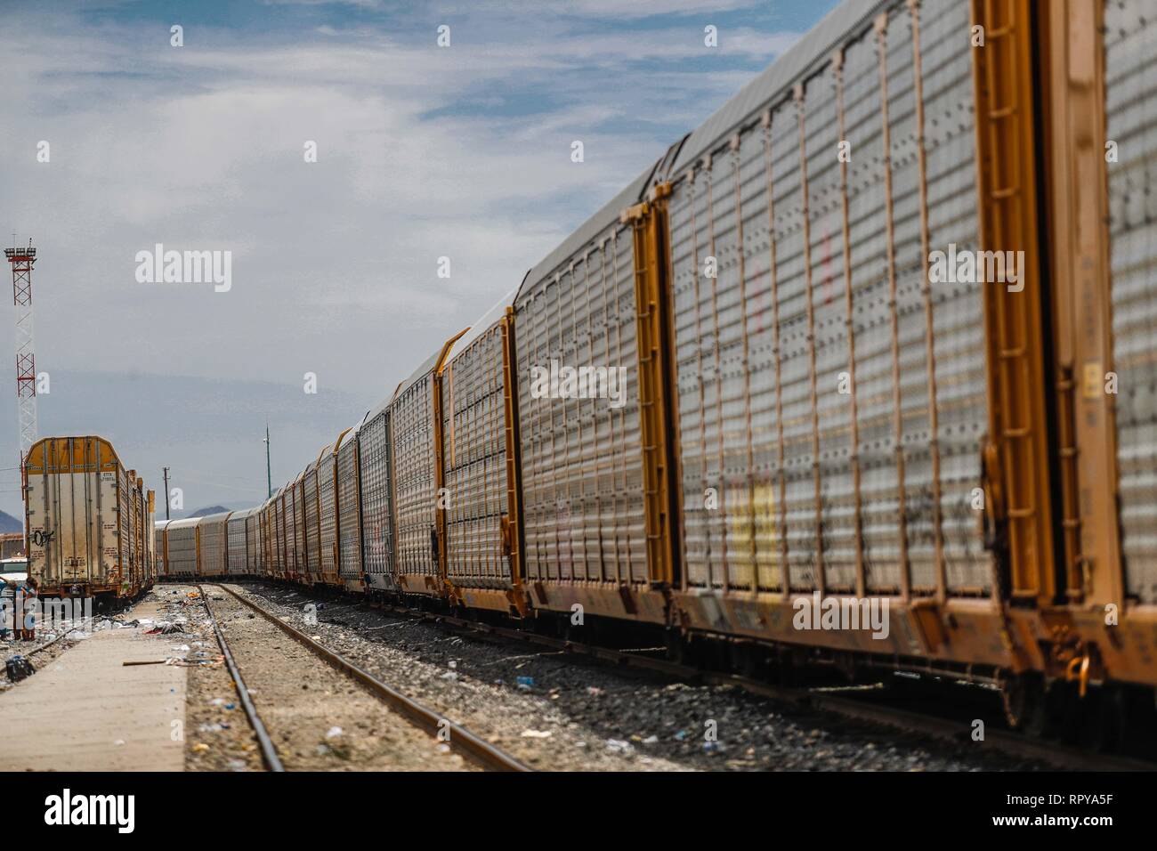 Train or Mexican railways passing through the popular colony in ...