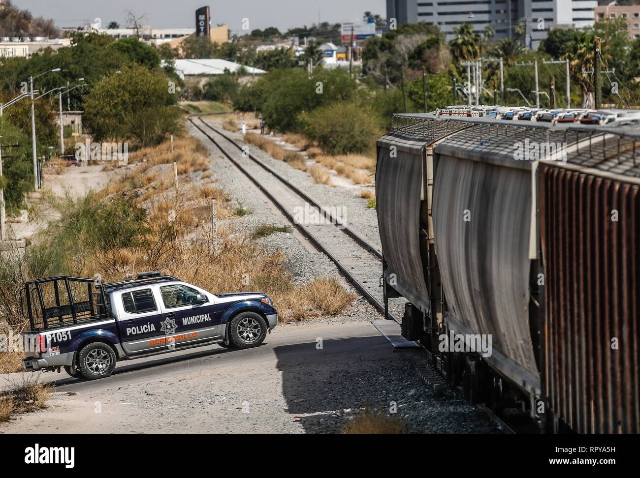 Train or Mexican railways passing through the popular colony in ...
