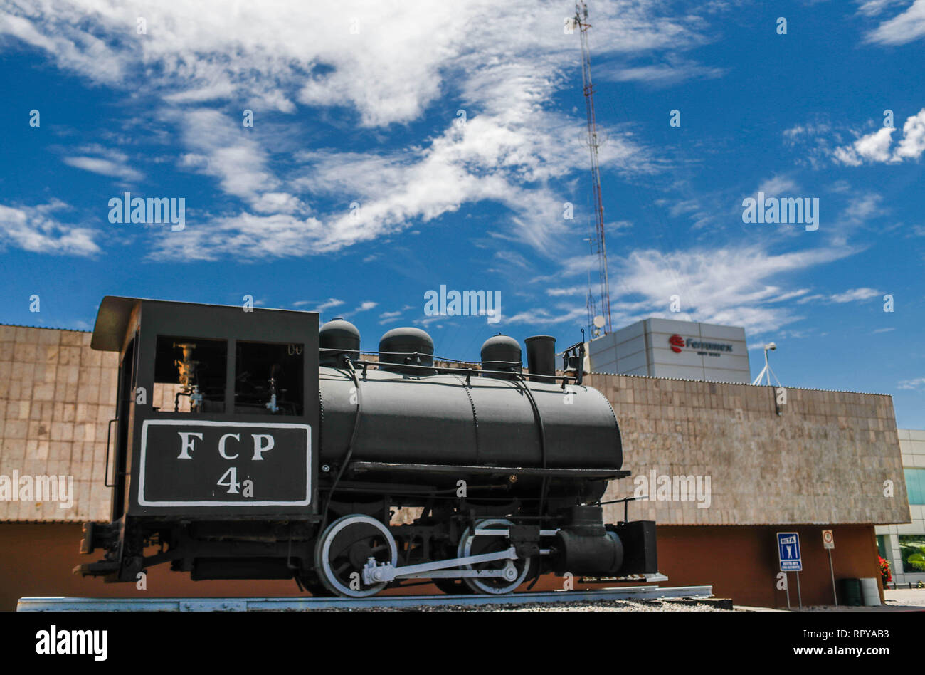 Train or Mexican railways passing through the popular colony in ...