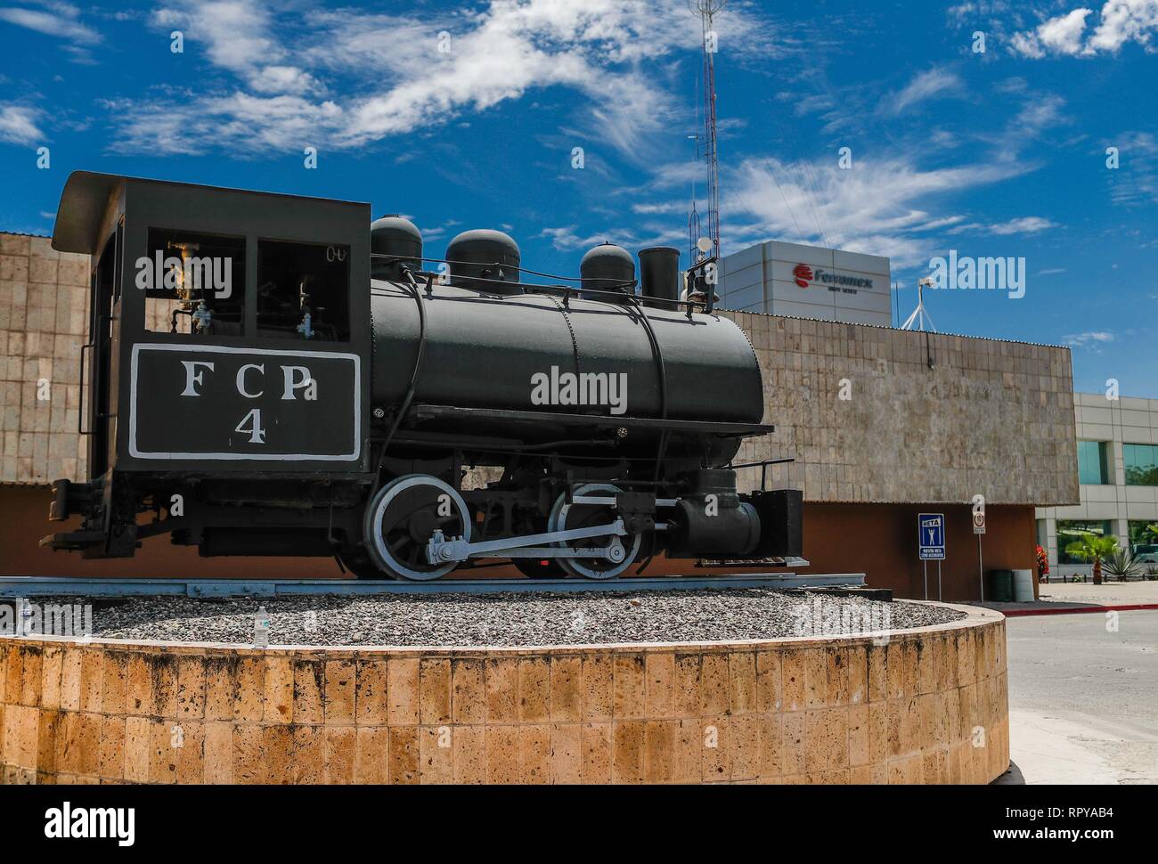 Train or Mexican railways passing through the popular colony in ...