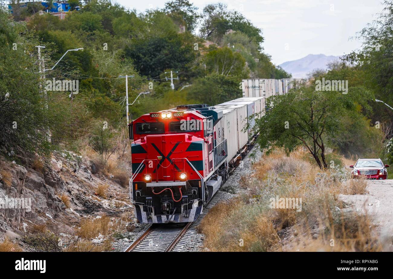 Train or Mexican railways passing through the popular colony in ...