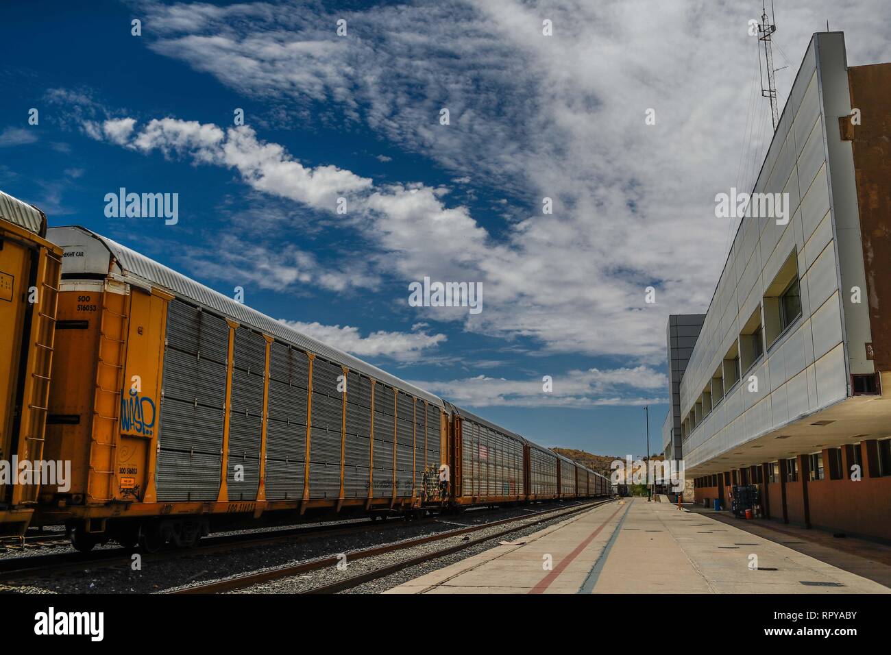 Train or Mexican railways passing through the popular colony in ...