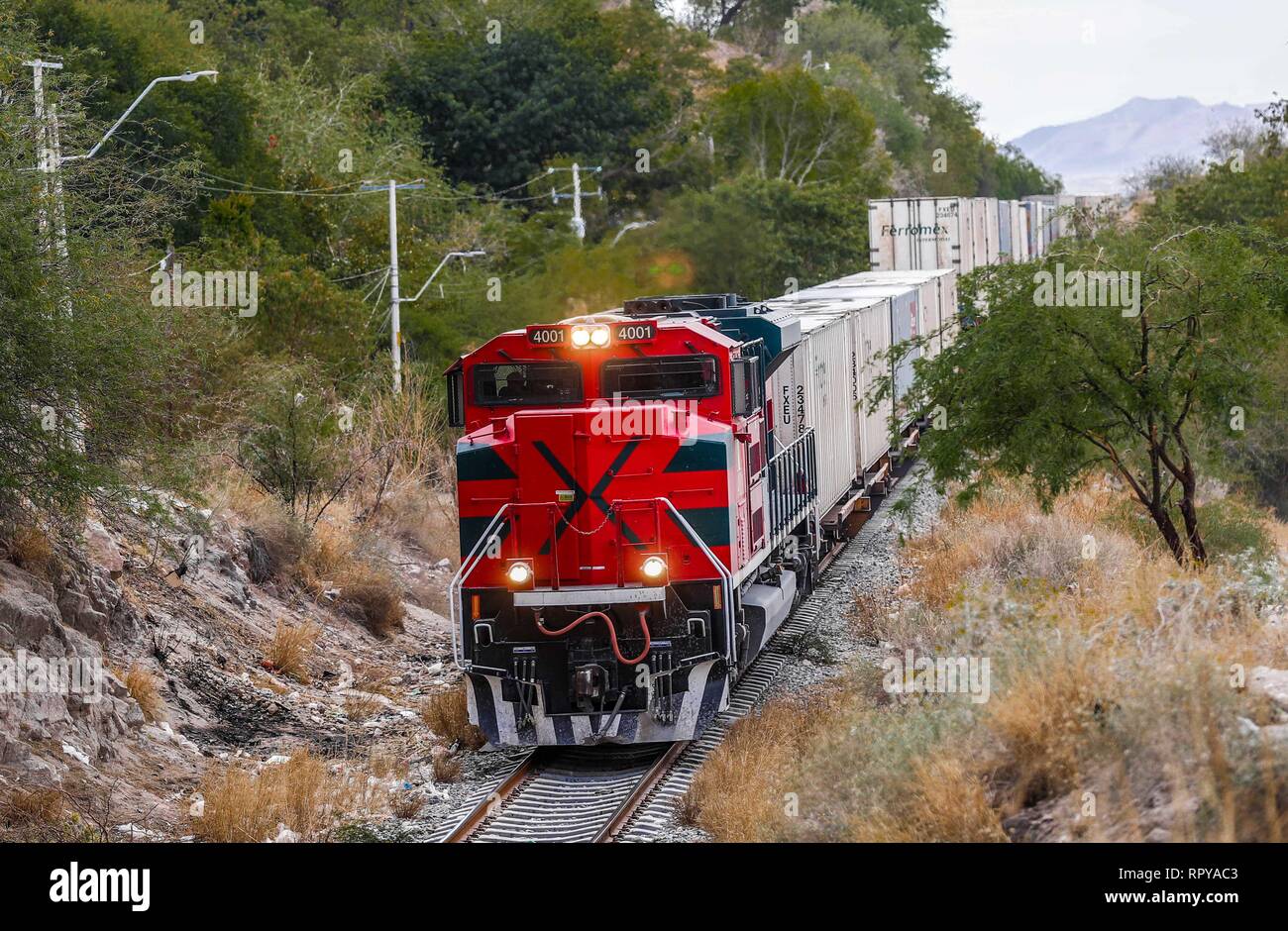 Train or Mexican railways passing through the popular colony in ...