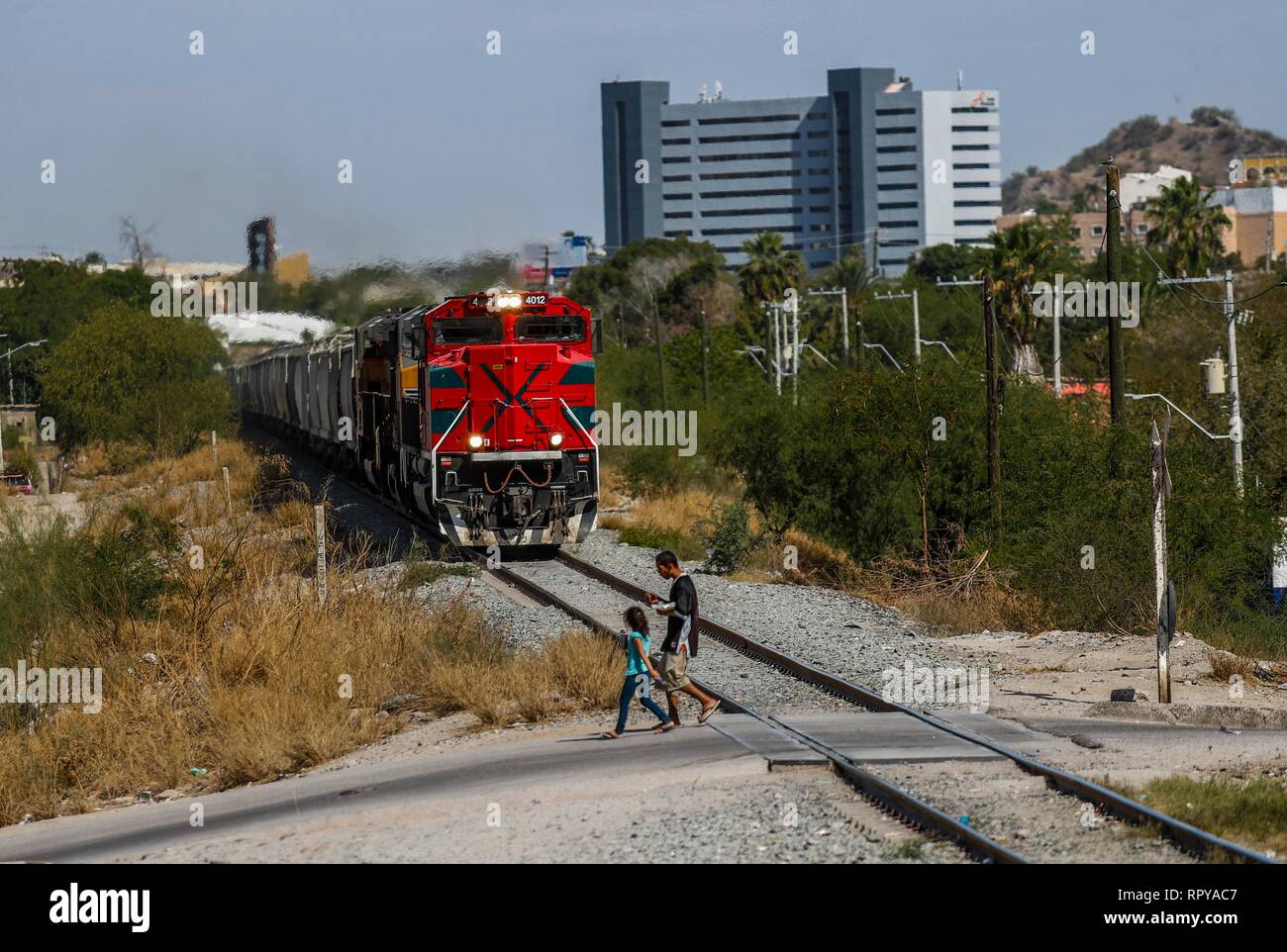 Train or Mexican railways passing through the popular colony in ...