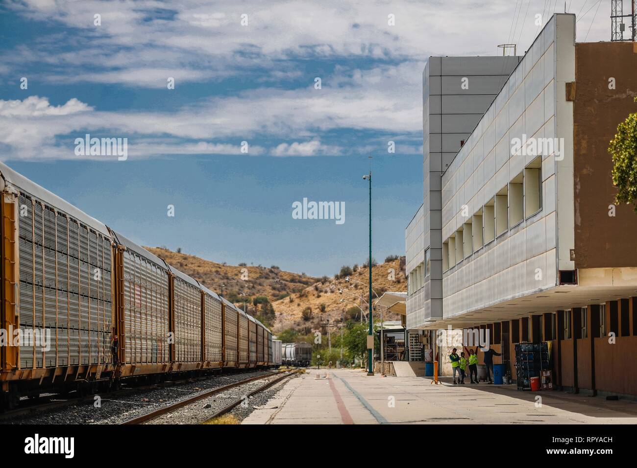 Train or Mexican railways passing through the popular colony in ...