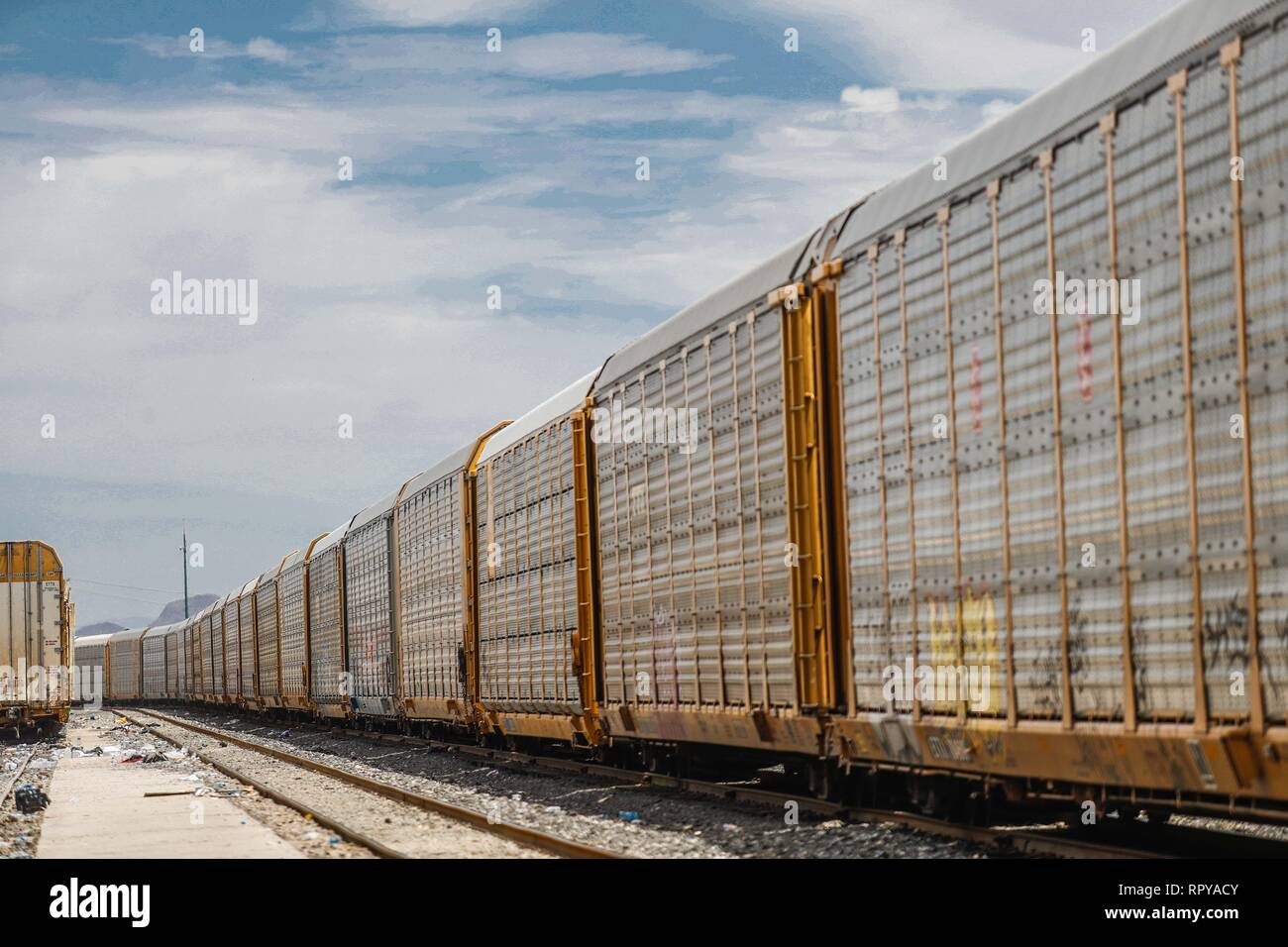 Train or Mexican railways passing through the popular colony in ...