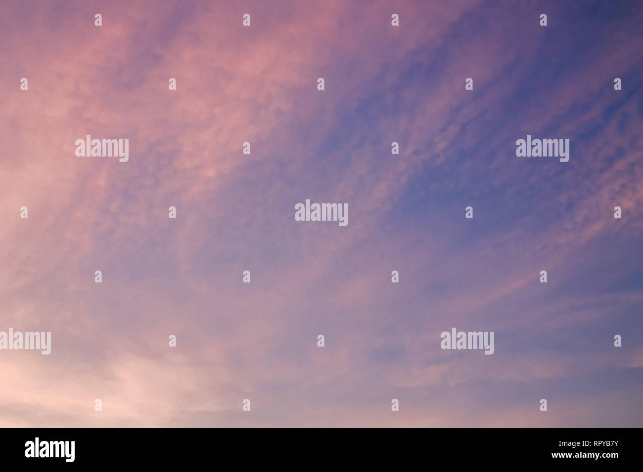 Pink cloudy sky background at sunset. Natural texture Stock Photo - Alamy