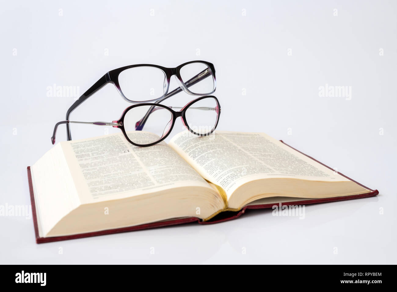 Two glasses for women with monofocal lenses and book Stock Photo - Alamy