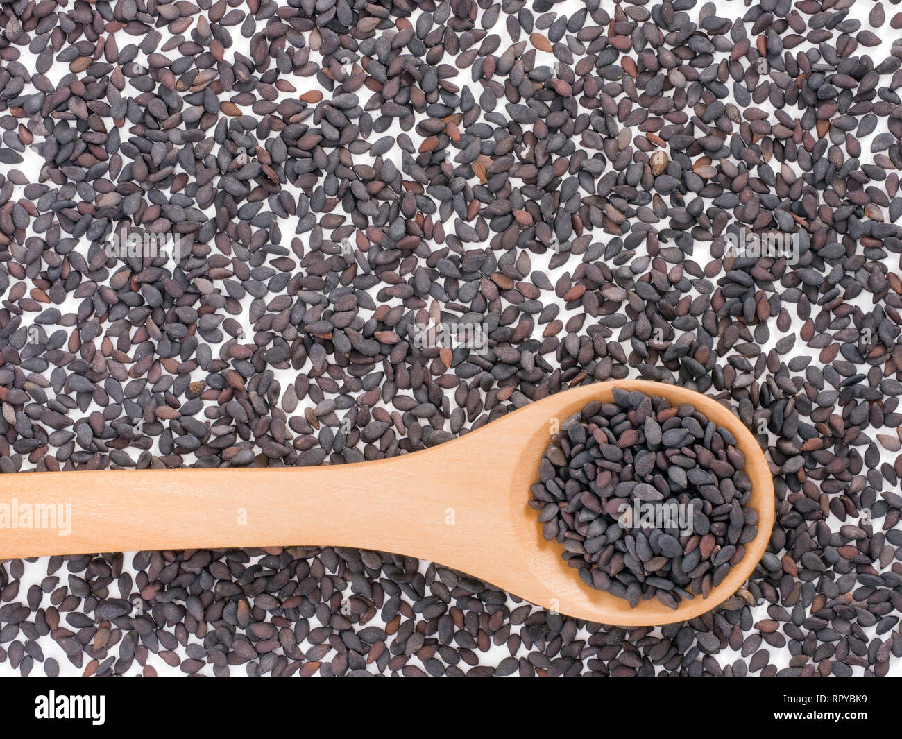 Black sesame texture as background. Top view or flat lay Stock Photo ...
