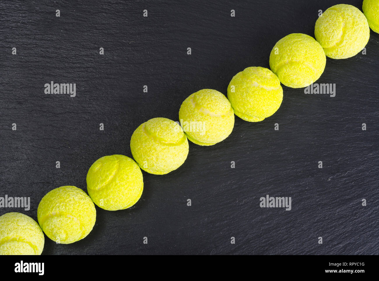 Round balls of chewing candies on black background. Studio Photo Stock ...