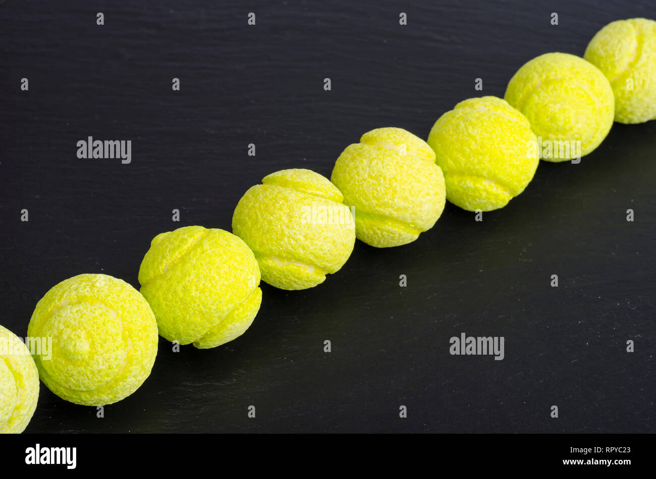 Round balls of chewing candies on black background. Studio Photo Stock ...