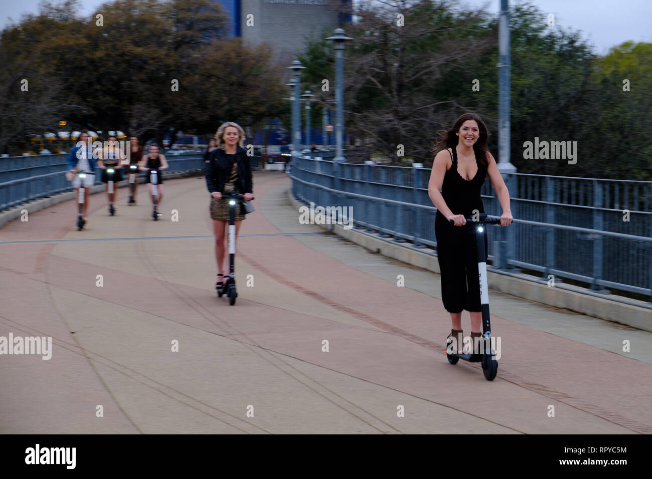 Women rides scooter hi-res stock photography and images - Alamy