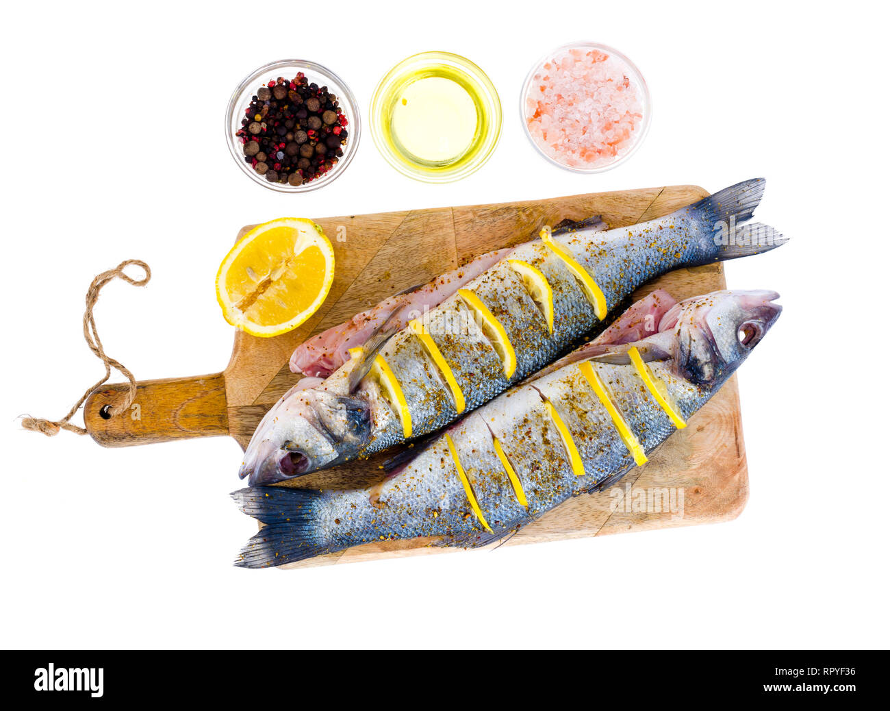 Dicentrarchus labrax fish with lemon for cooking. Studio Photo Stock ...