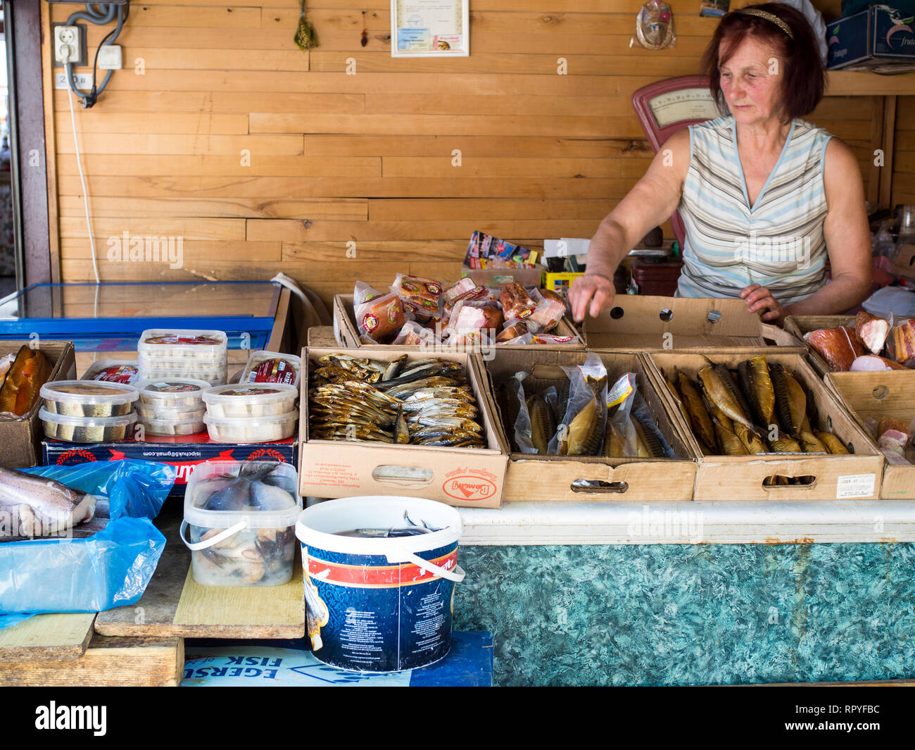 A woman selling dried fish on the market in Kolomyia, in Ukraine Stock ...