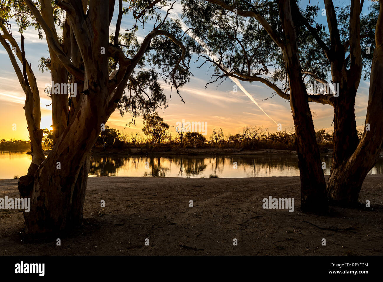 SUNSET OVER THE RIVER MURRAY WETLANDS IN SOUTH AUSTRALIA. VIEWS OF A ...