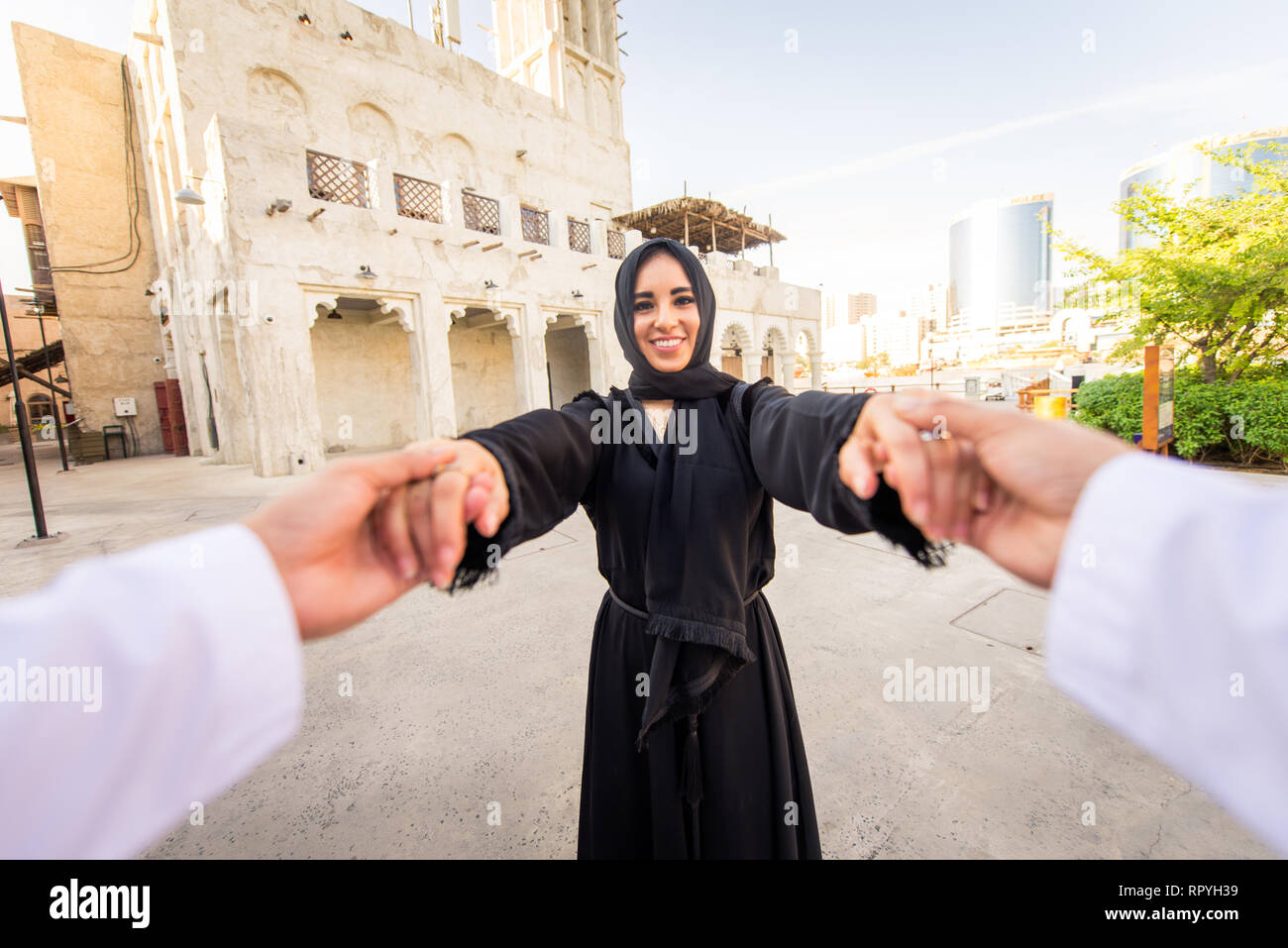 Arabian couple with traditional emirates dress dating outdoors - Happy ...