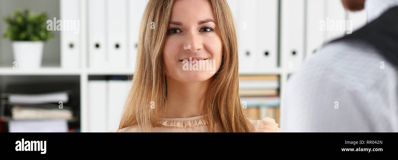 Beautiful smiling cheerful girl at workplace Stock Photo - Alamy
