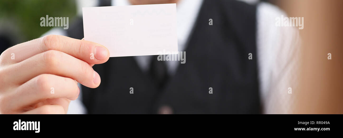 Male hand in suit give blank calling card to visitor Stock Photo - Alamy
