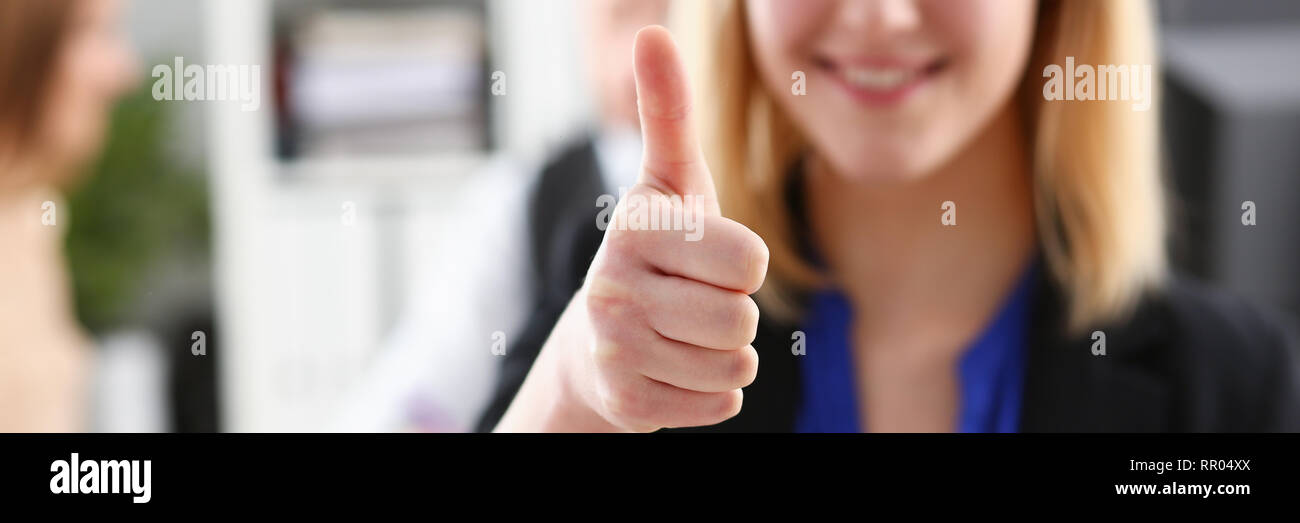 Beautiful smiling woman showing OK Stock Photo - Alamy