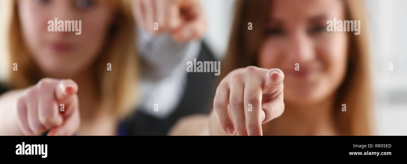 A group of business people pointing their Stock Photo - Alamy