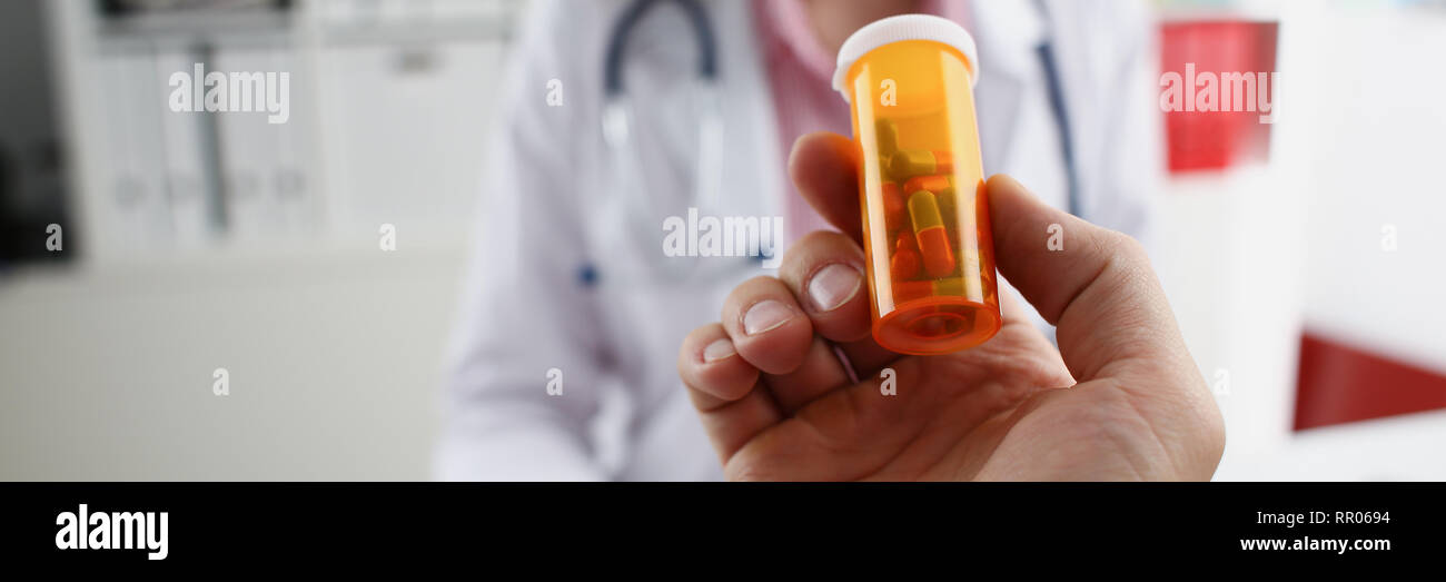male medicine doctor hand hold jar of pills Stock Photo - Alamy
