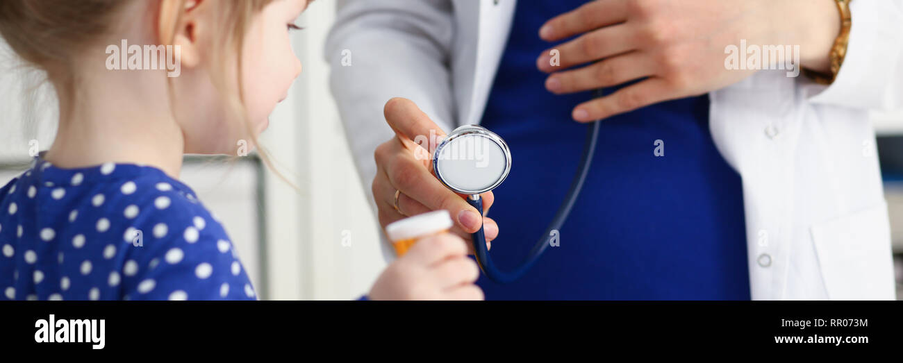 Little child with stethoscope at doctor reception Stock Photo - Alamy