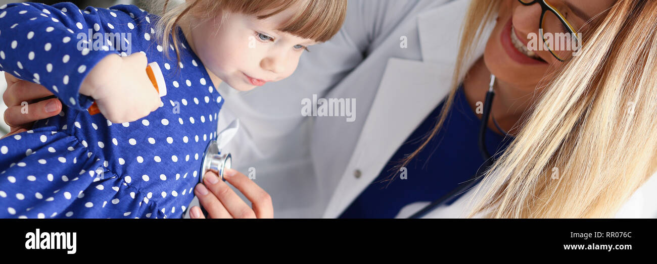 Little child with stethoscope at doctor reception Stock Photo - Alamy