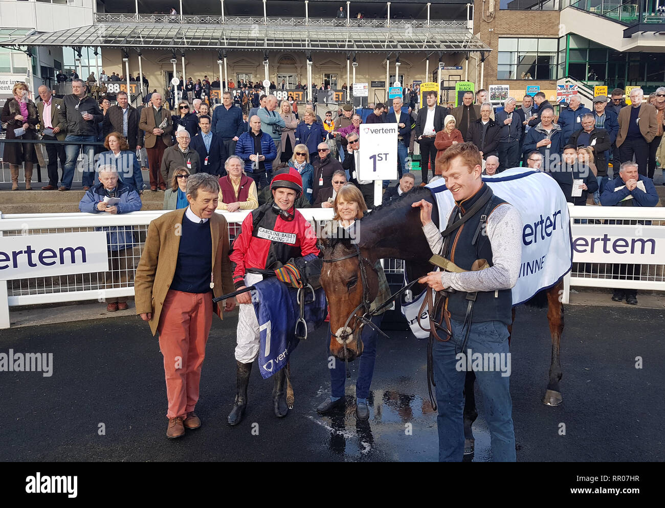 Winning trainer Caroline Bailey and jockey Jamie Moore pose with ...