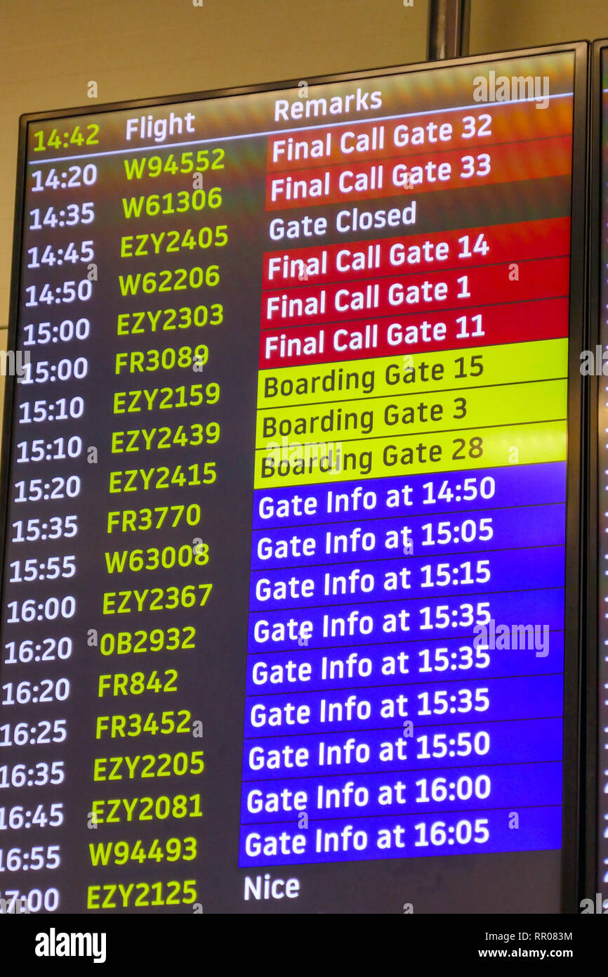 Colourful departure board at Luton Airport, Luton, London, England, UK ...