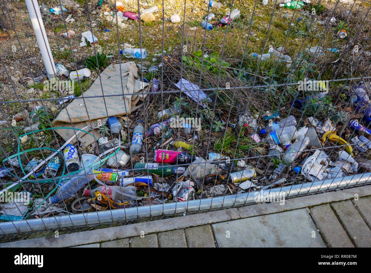 Litter, garbage, trash behind fence, Luton Airport, Luton, London, England, UK Stock Photo - Alamy