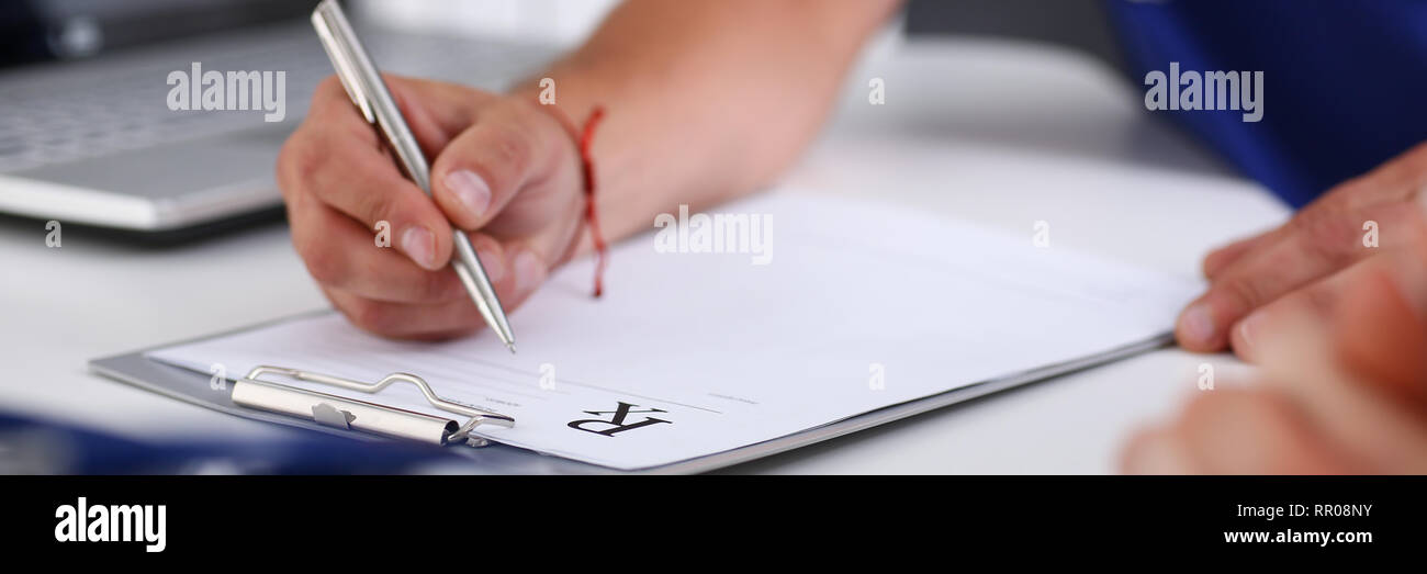 Male doctor hand write prescription at office Stock Photo - Alamy