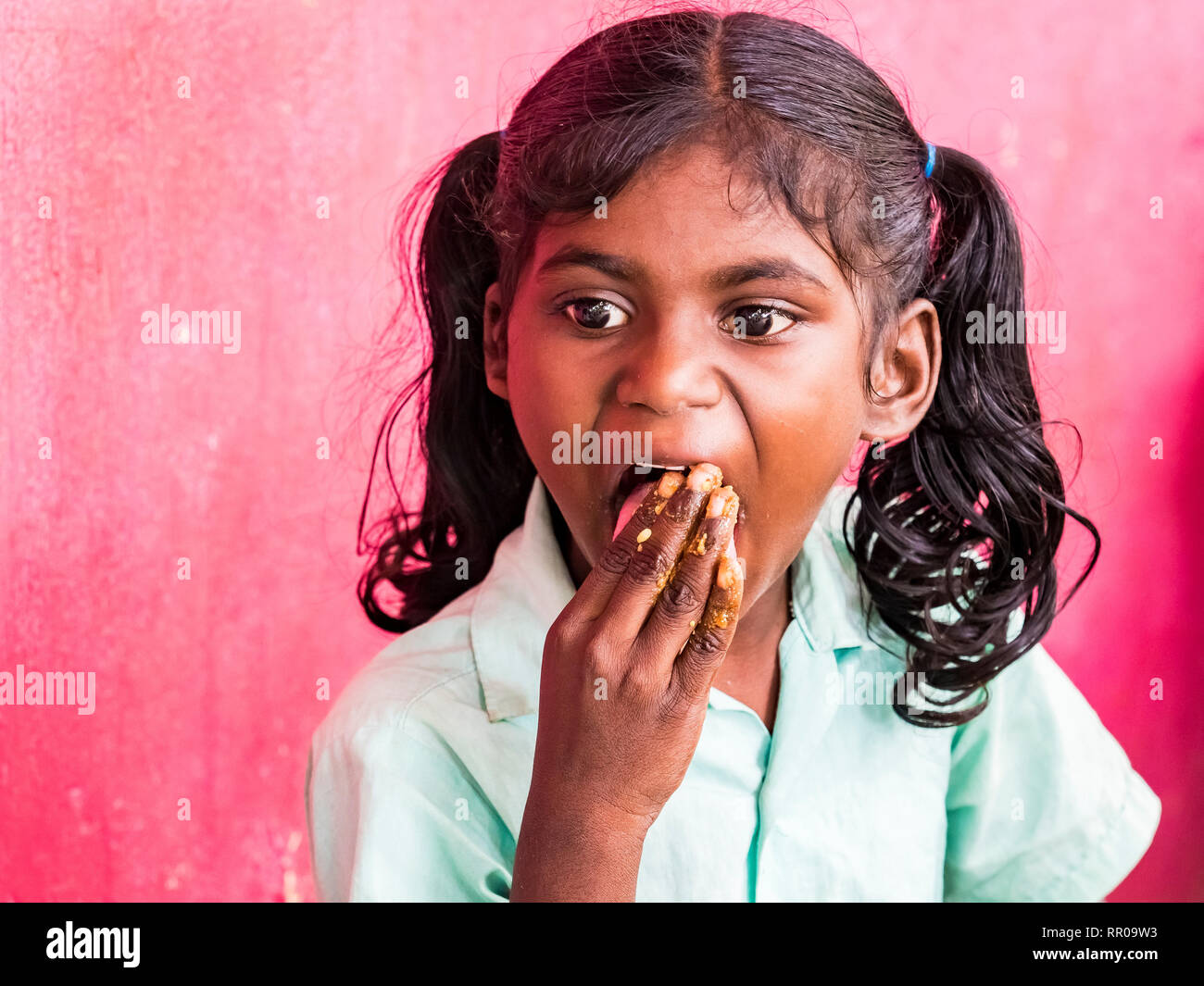 Girl indian eating rice hi-res stock photography and images - Alamy