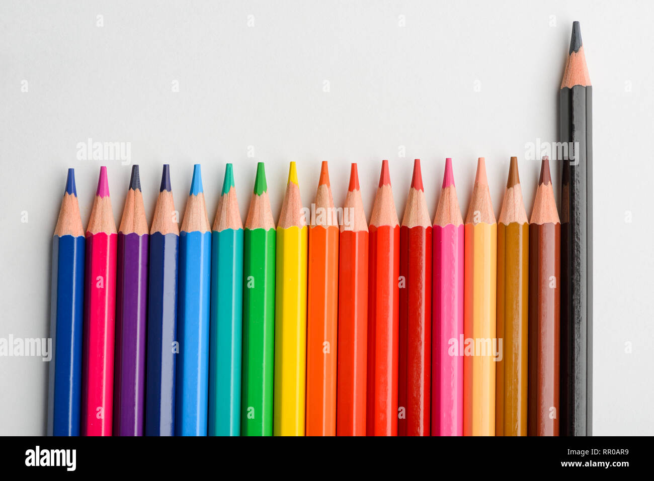 Colored pencils against black Stock Photo - Alamy