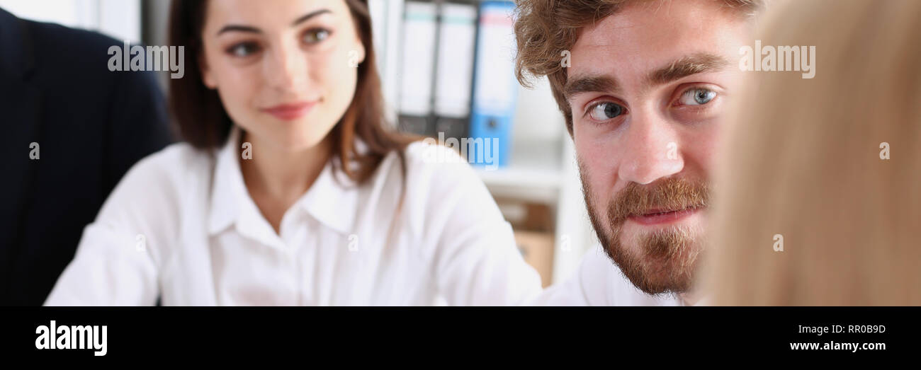 Group of people deliberate on white board Stock Photo - Alamy