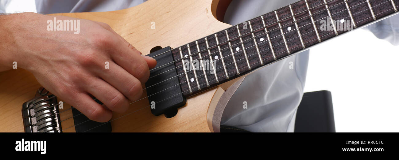 Male arms playing classic shape electric guitar Stock Photo - Alamy