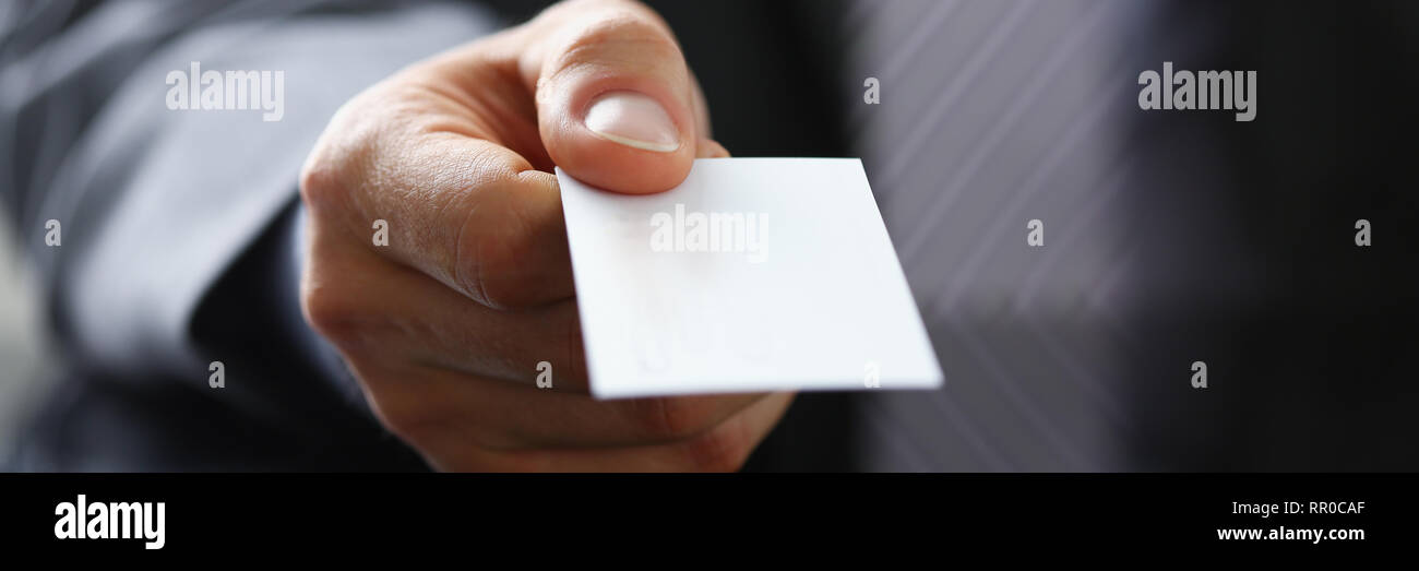 Male arm in suit give blank calling card Stock Photo - Alamy